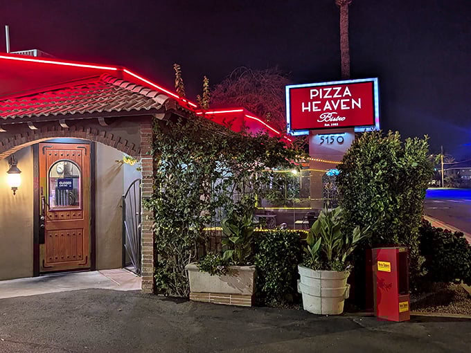 Pizza Heaven's neon sign glows like a homing beacon for hungry souls wandering through the Phoenix night.