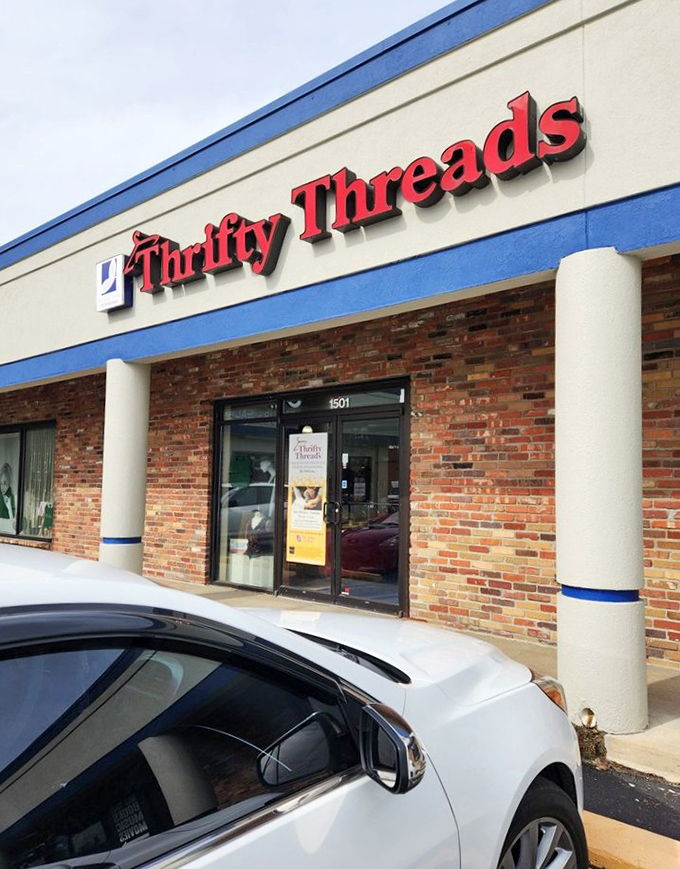 Thrifty Threads' bold red sign against brick promises a shopping adventure beyond the ordinary discount rack.