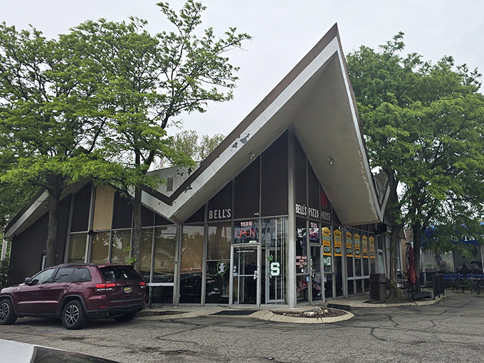 That dramatic roofline isn't just for show – it's sheltering pizza perfection that generations of Spartans have sworn by.