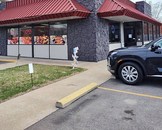 Colorful food displays in the windows give passersby a tempting preview of the Cajun feast waiting inside.