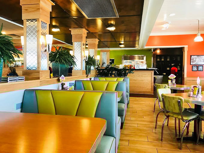 Dot Coffee Shop's colorful booths create a cheerful rainbow where Houston locals gather for morning conversations.