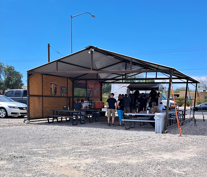 No frills, all flavor. El Sinaloense's humble cart is where hot dog dreams come true, one bacon-wrapped masterpiece at a time.