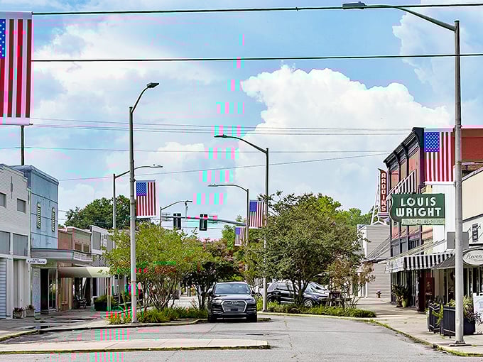 American flags line Eunice's charming main street, where small-town pride meets Louisiana hospitality under blue skies.