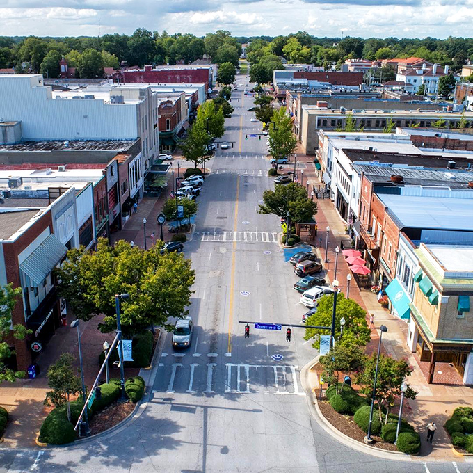 Florence's tree-lined downtown streets offer shade for window shoppers and house hunters alike, where musical heritage meets budget-friendly living.