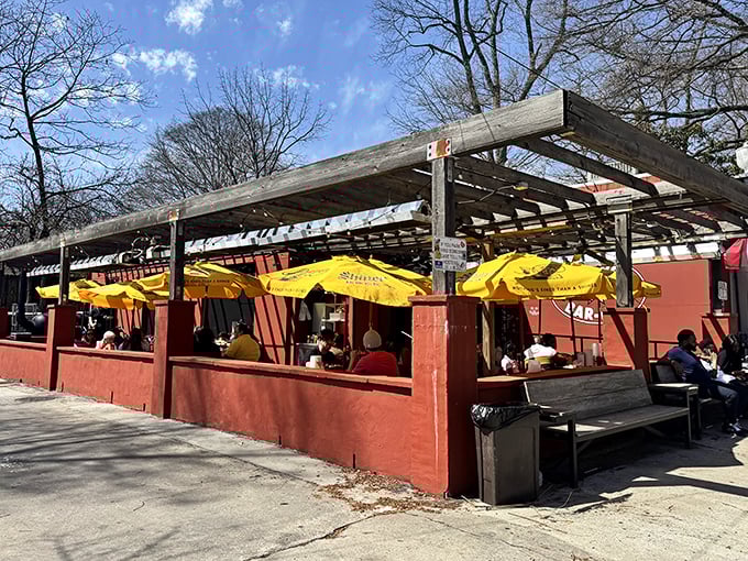 Fox Bros' outdoor seating area becomes a community gathering spot. Nothing brings strangers together like the promise of perfect pulled pork!