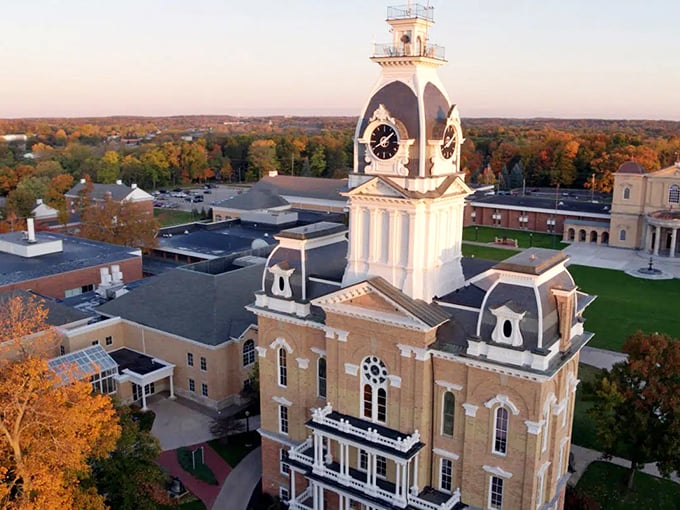 Hillsdale's historic courthouse clock tower stands proudly against a backdrop of autumn colors and small-town charm.