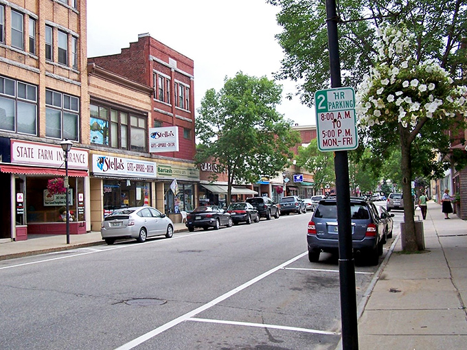 Pedestrians navigate Rumford's crosswalks beneath a canopy of utility lines and possibility. Small-town prices, big-town character.