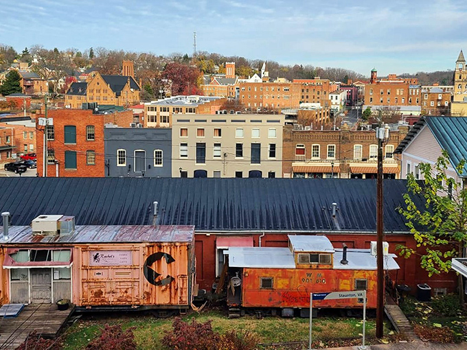 Historic Staunton's colorful skyline with vintage train cars resting below the charming downtown buildings.