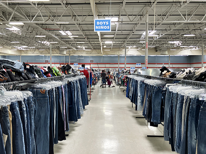 Denim for days! The clothing section alone could dress half of Texas, while furniture waits patiently in the background.