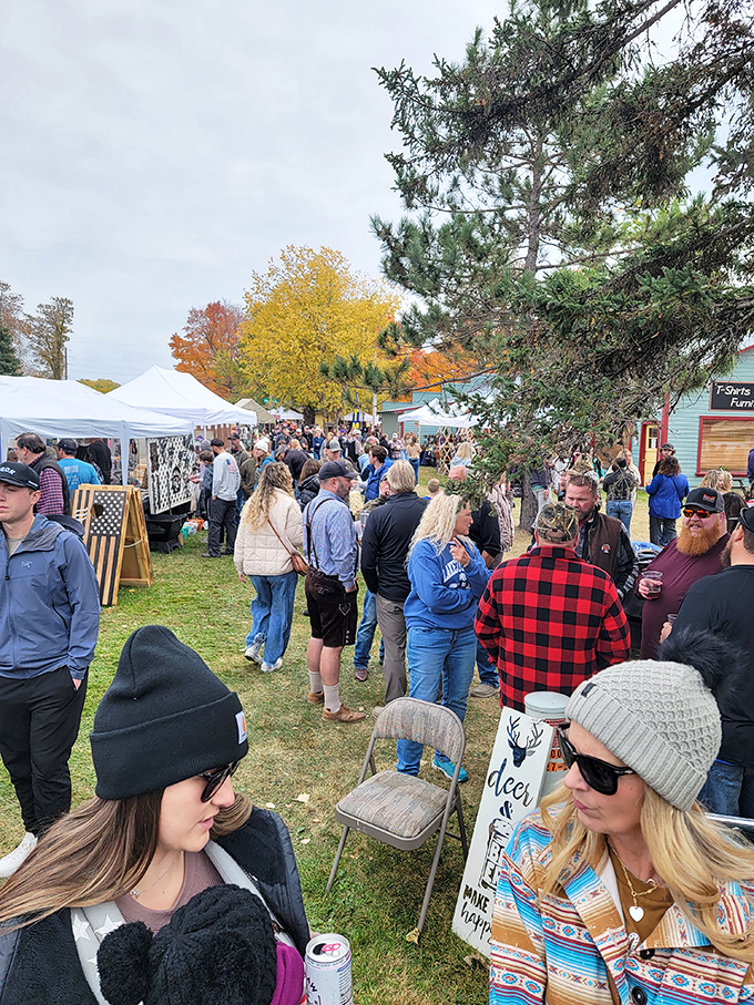 Autumn treasure hunting! Fall colors frame the bustling crowd at The Vintage Pixie Farm, where flannel-clad shoppers hunt for rustic-chic bargains.