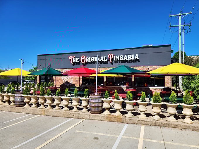 Vibrant umbrellas and rustic barrels create the perfect pizza patio. The Original Pinsaria knows atmosphere is as important as ingredients.