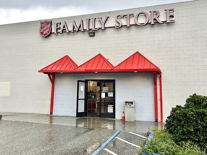 Rain can't dampen the thrill of Salvation Army bargain hunting. That red awning shelters furniture dreams waiting to come home with you.