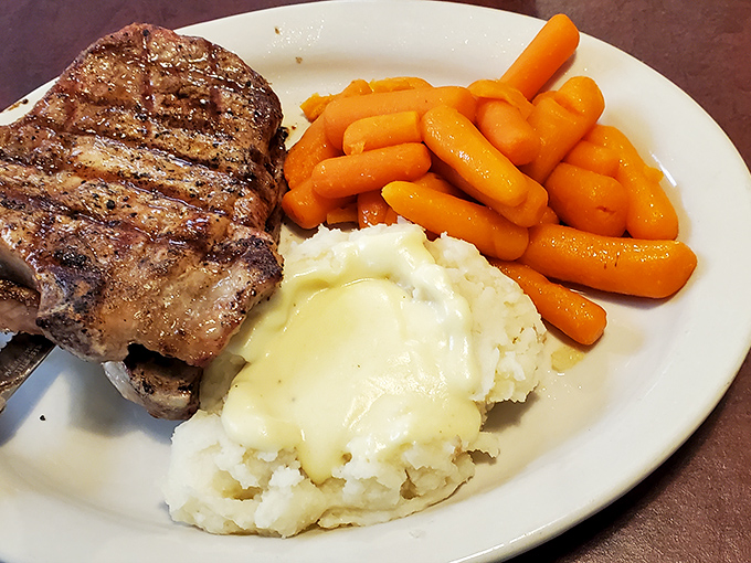That perfectly grilled steak with real mashed potatoes and glazed carrots is what food photographers wish they could capture&mdash;honest food, honestly delicious.