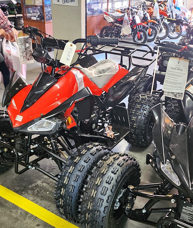 Not all treasures fit in shopping bags. This shiny red ATV represents the "go big or go home" philosophy of flea market adventuring.