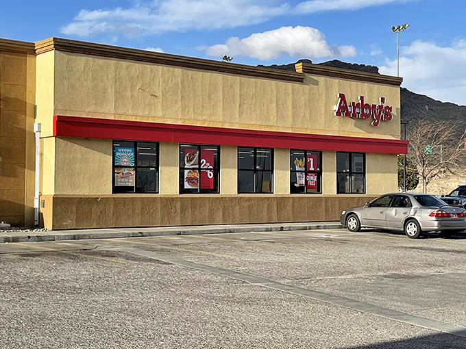 Even fast food feels like a bargain here. This Arby's stands ready to satisfy your roast beef cravings against a backdrop of desert mountains.