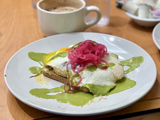 Green goddess goodness! This avocado toast with pickled onions and poached egg proves breakfast can be both virtuous and decadent.