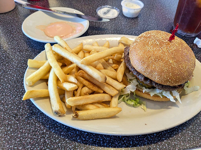 This classic burger doesn't need fancy toppings to shine&mdash;just honest ingredients and decades of grill-top wisdom.