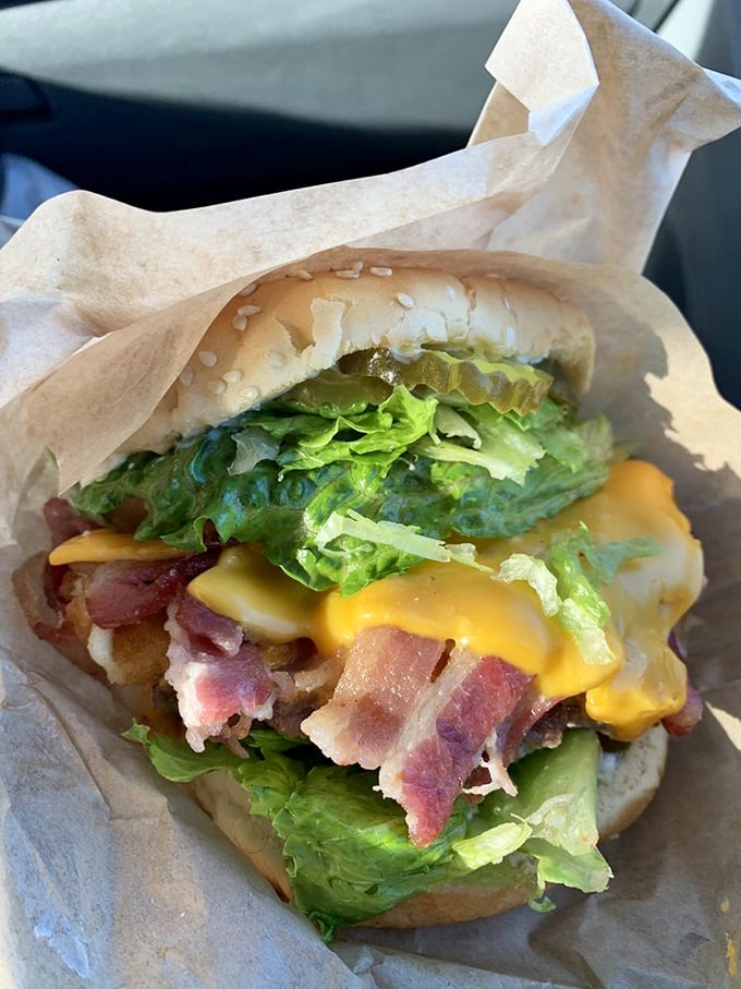 Bacon, cheese, and fresh veggies stacked with architectural precision. This isn't fast food&mdash;it's slow food worth waiting for.