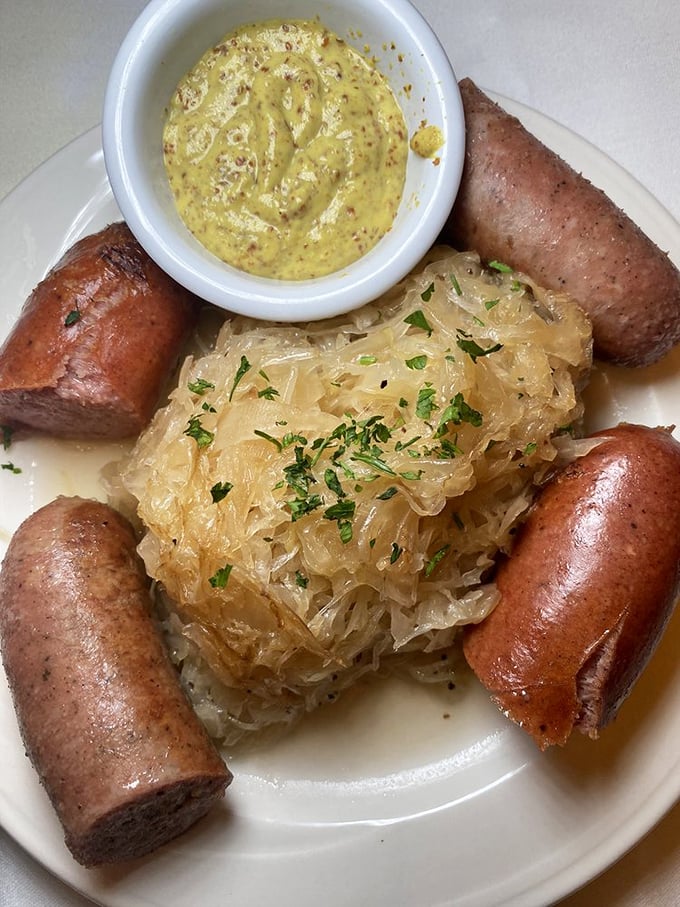Sauerkraut and sausages&mdash;the dynamic duo of German cuisine&mdash;surrounded by mustard that's dressed up fancier than most people at a Michigan wedding.