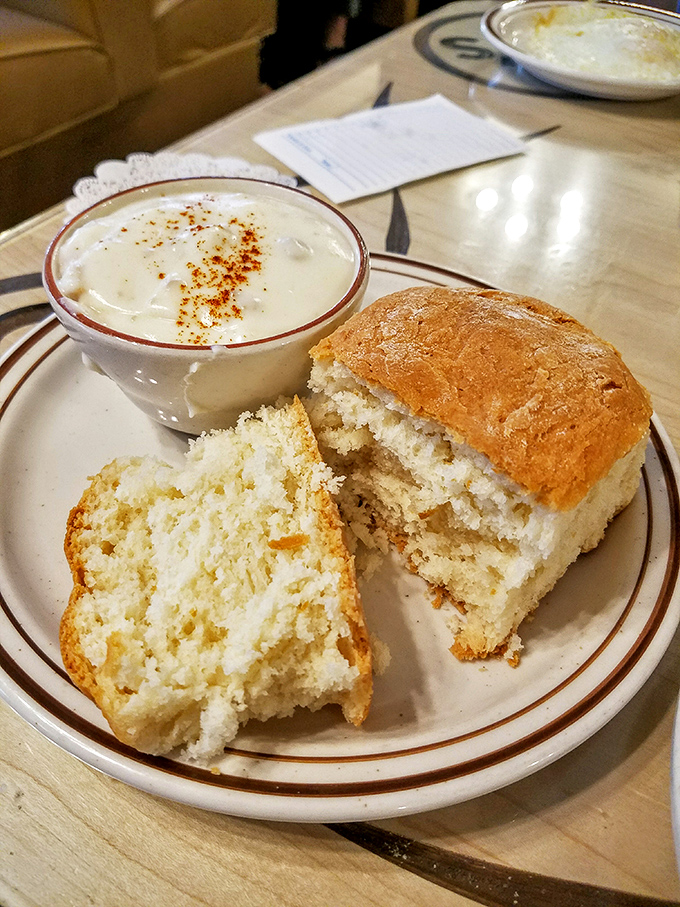 These homemade biscuits look like they've been taking cloud-fluffiness lessons, ready to soak up that peppery gravy like edible sponges.