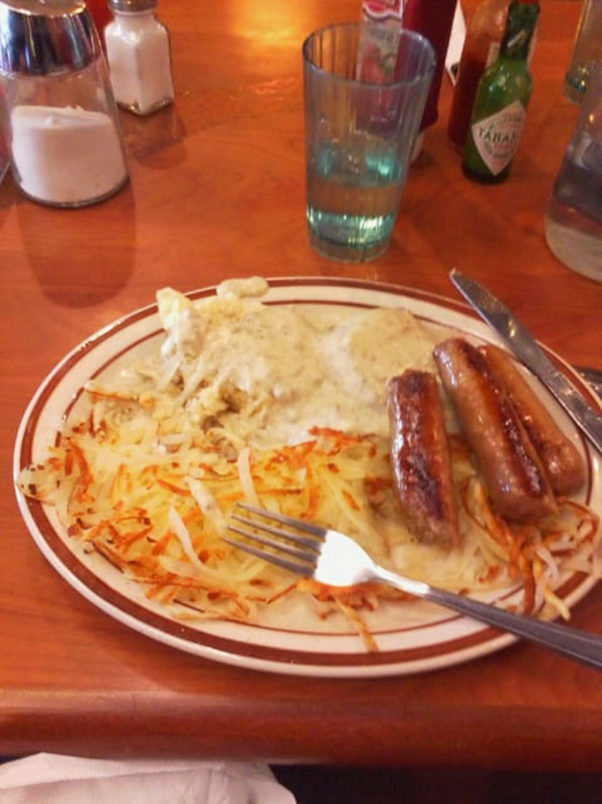 Breakfast nirvana: sausage links nestled alongside creamy eggs and hash browns&mdash;the morning equivalent of a warm hug.