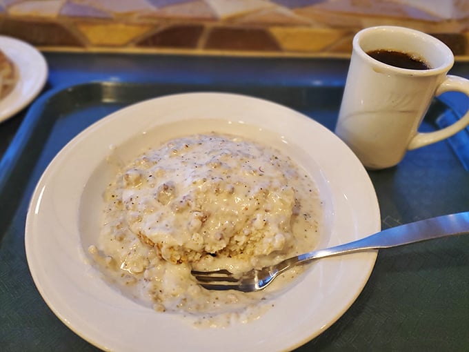 Biscuits and gravy: the breakfast that hugs you from the inside, where pillowy biscuits surrender to creamy, peppery gravy.
