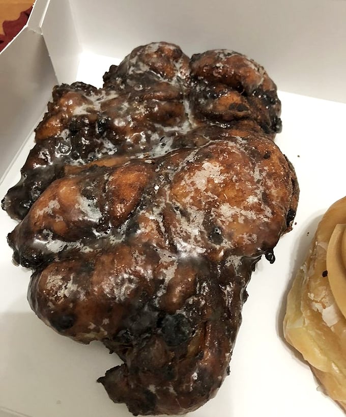 This blueberry fritter isn't just a donut&mdash;it's a commitment. Dark, mysterious, and glazed to perfection, it's breakfast disguised as dessert.
