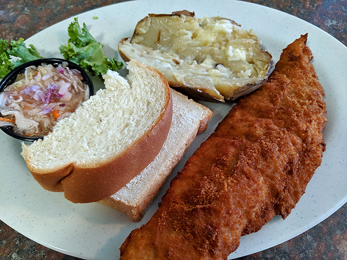 Breaded haddock that's crispy enough to make a satisfying crunch heard three tables over. The slice of rye bread stands ready for its supporting role.