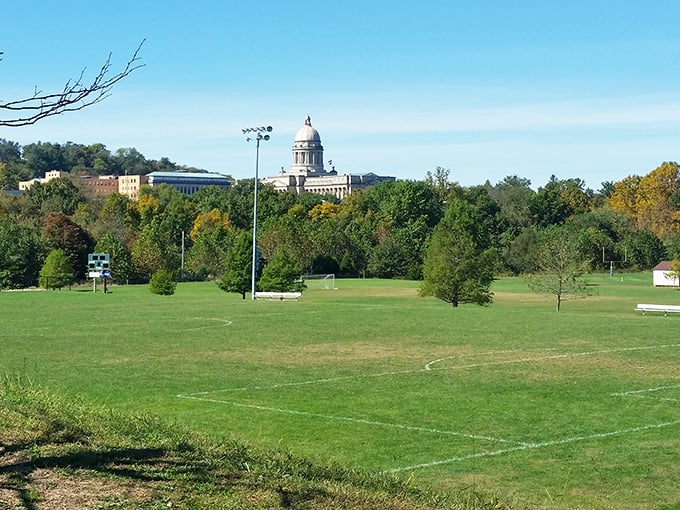 The state capitol building peeks through the trees, reminding visitors that Frankfort balances political significance with small-town tranquility.