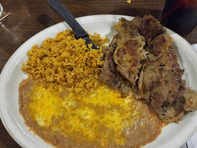 The carne asada plate doesn't just feed you &ndash; it respects you, offering perfectly seasoned meat alongside rice that actually has personality.