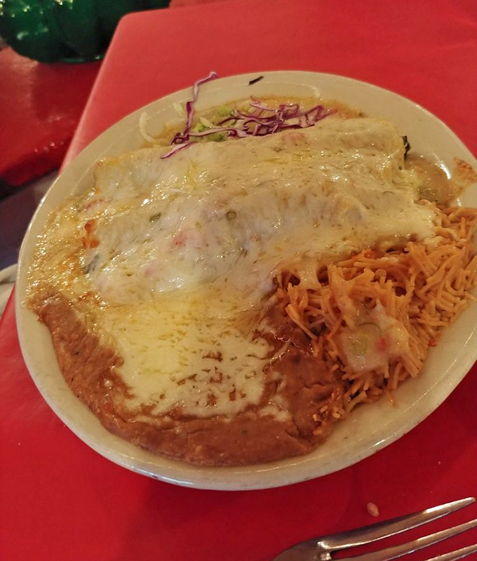 Cheese blankets these enchiladas like an Arizona sunset, melting into a pool of sauce that demands to be sopped up with every last tortilla chip.