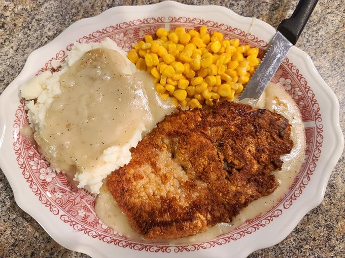 Country-fried steak that's traveled through time from your childhood dreams &ndash; crispy coating, tender meat, and gravy that demands to be sopped up.