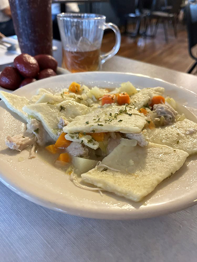 The legendary chicken pot pie in all its glory! Square noodles swimming alongside tender chicken in a broth so good you'll contemplate drinking it straight.