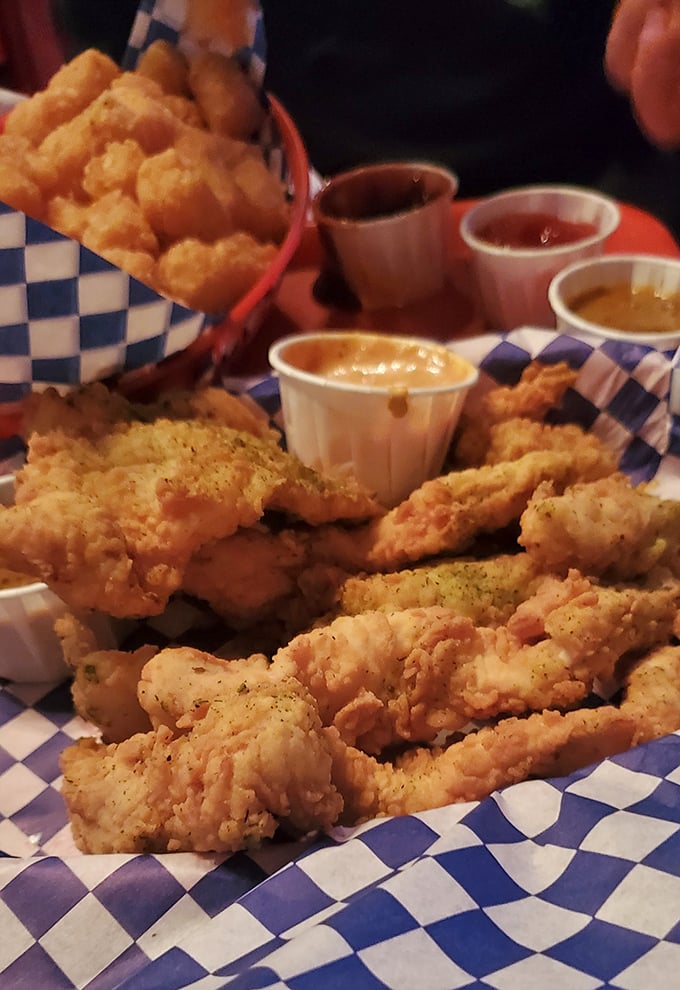 Crispy chicken strips and tots served in checkered paper with a rainbow of dipping sauces&mdash;proof that sometimes the simplest pleasures are the most satisfying.