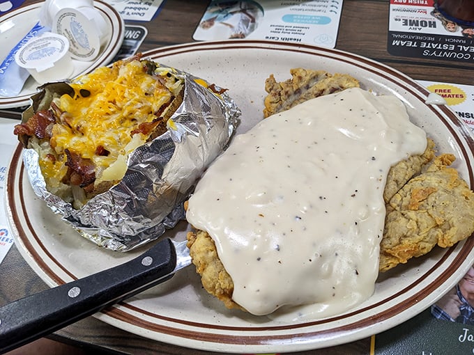 Not just chicken fried steak&mdash;it's chicken fried salvation, baptized in peppery gravy with a loaded baked potato as its faithful companion.