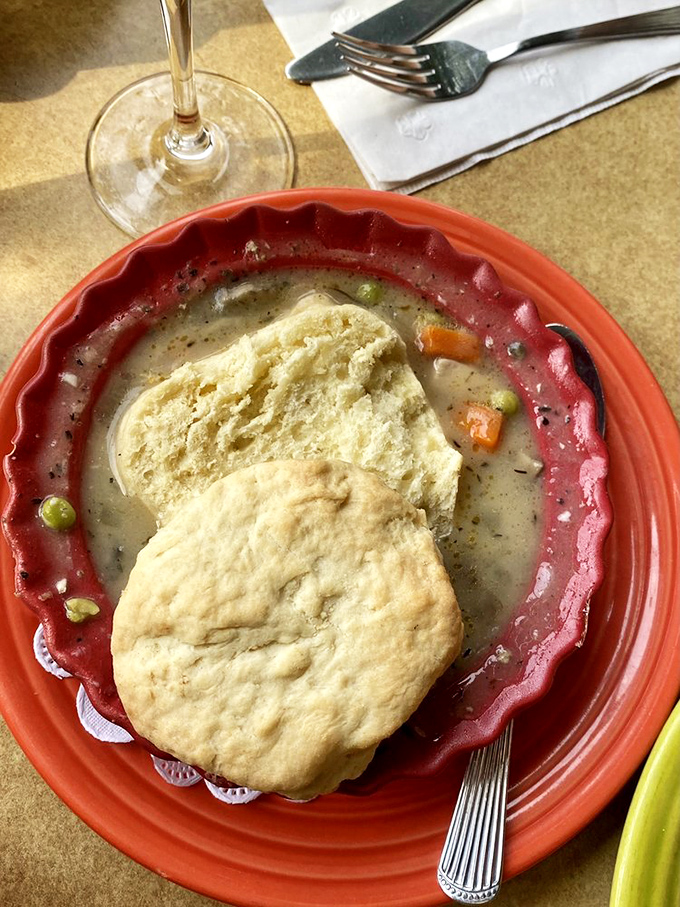 Chicken pot pie reimagined—where a homemade biscuit floats atop a sea of creamy comfort that would make your grandmother both jealous and proud.