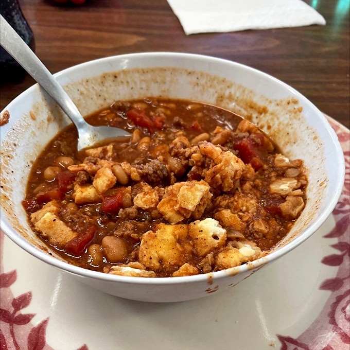 This isn't your city slicker's chili—it's hearty, homemade comfort in a bowl, with chunks of everything good under the prairie sun.