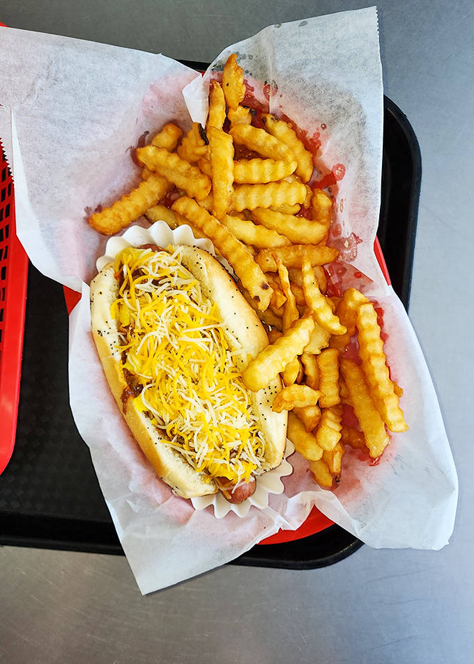 Crinkle-cut fries and a cheese-smothered dog – the comfort food equivalent of a warm hug from your favorite aunt who never judges your life choices.