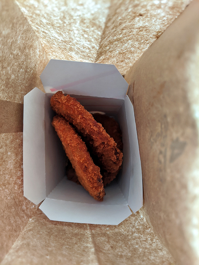 These golden-fried morsels aren't just food; they're edible souvenirs of the Atlantic, each bite a tiny postcard from the sea.