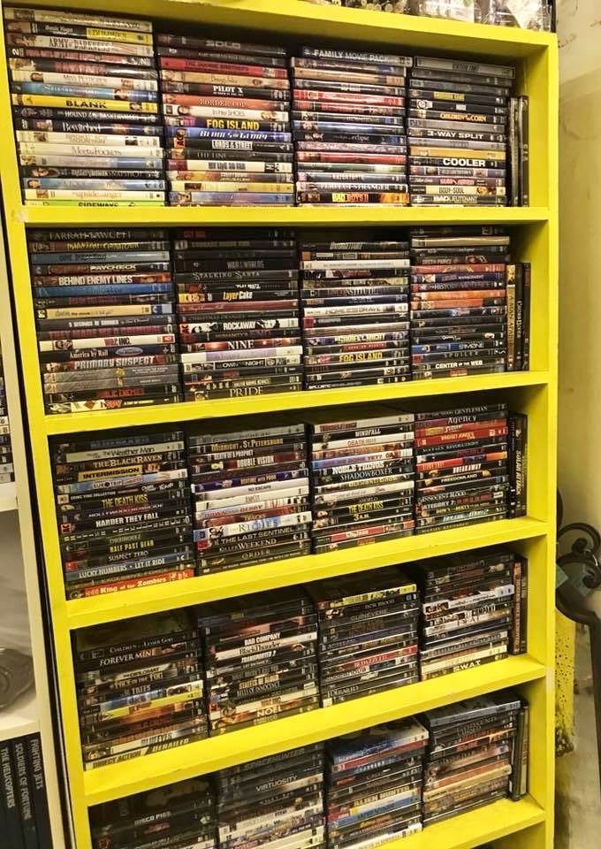 Remember when choosing a movie meant physically browsing? This DVD collection is Netflix's ancestral family album, preserved in plastic cases.