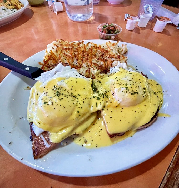 Eggs Benedict done right&mdash;hollandaise so velvety it could moonlight as a luxury bedspread. Those hash browns deserve their own fan club.