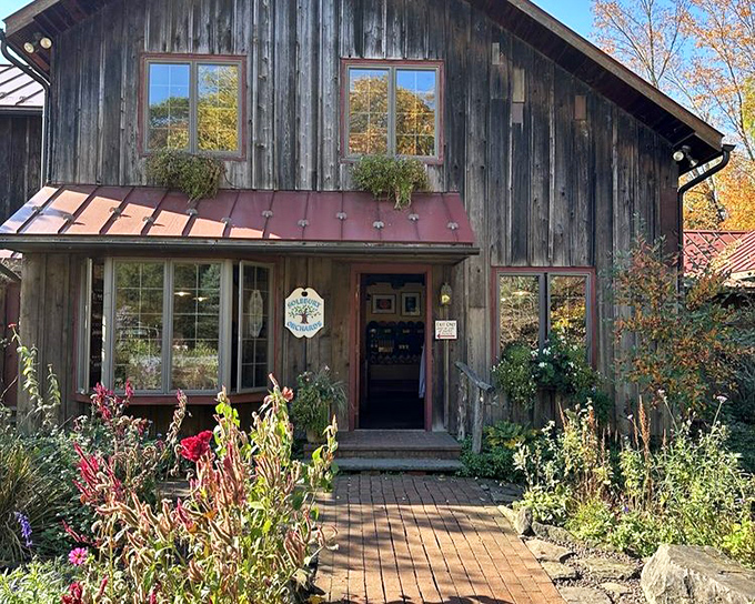 The farm store entrance beckons with rustic charm and seasonal blooms. Even the architecture seems to say, "Come taste what Pennsylvania grows."