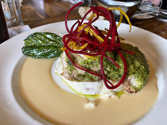 Fish so fresh it practically introduces itself to you. That vibrant herb crust and creamy sauce are playing a symphony your taste buds won't forget.