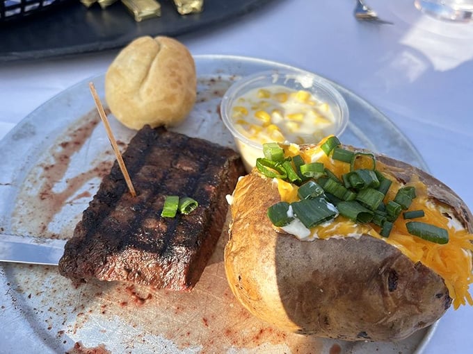 Simplicity perfected: a beautifully seared flat iron steak alongside a baked potato that's dressed for success. Comfort food with cowboy credentials.