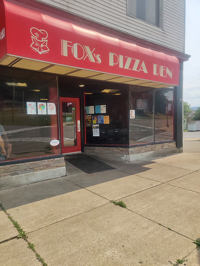 Fox's Pizza Den, with its bold red awning, promises the kind of no-nonsense pizza experience that makes chain restaurants seem soulless by comparison. Local institution status: confirmed.
