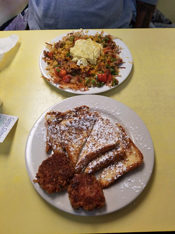 French toast that would make your grandmother jealous, dusted with powdered sugar like the first perfect snowfall of winter.