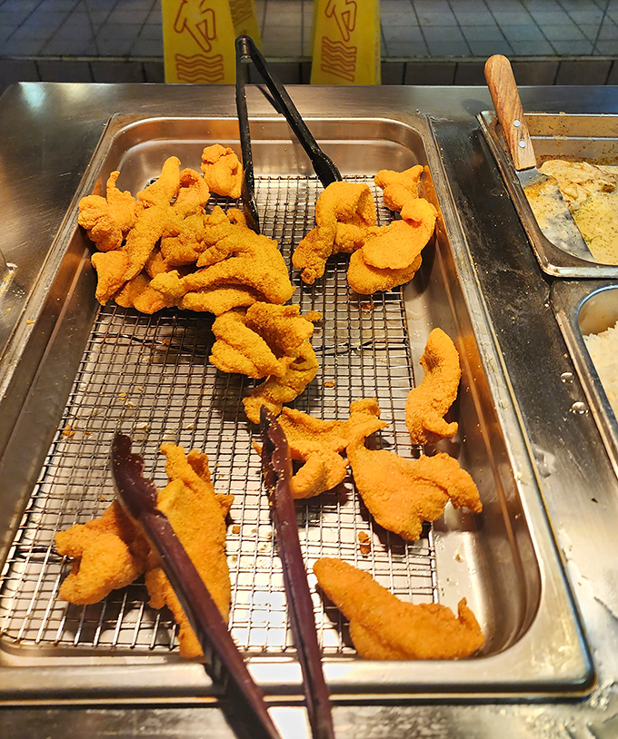 Crispy catfish that practically jumps from Arkansas waters to your plate. That golden cornmeal coating is what food dreams are made of.