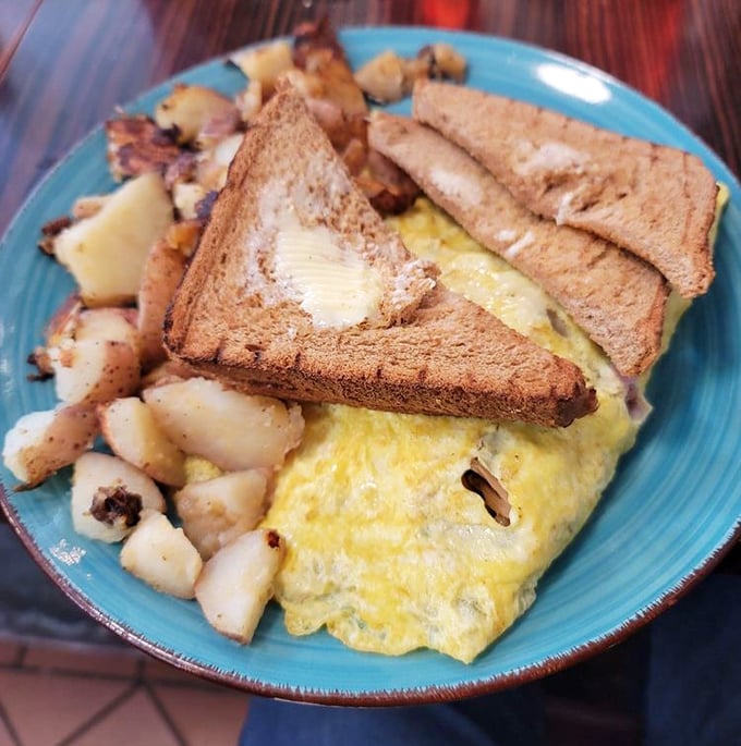 The perfect breakfast trinity: fluffy eggs, crispy home fries, and toast that's actually buttered while still hot. Revolutionary concept!