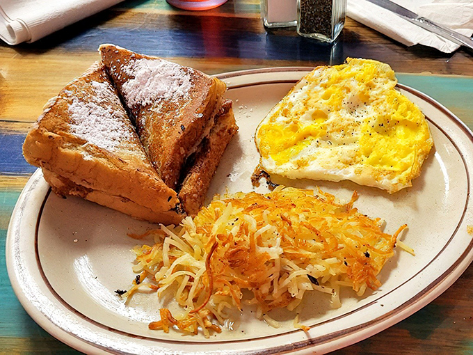 French toast that's achieved the impossible balance&mdash;crisp edges, custardy center&mdash;paired with hash browns so perfectly golden they deserve their own Instagram account.