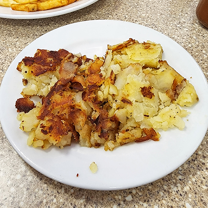 These home fries have achieved the impossible trifecta: crispy edges, fluffy centers, and just enough seasoning to make you forget you're technically eating breakfast potatoes.